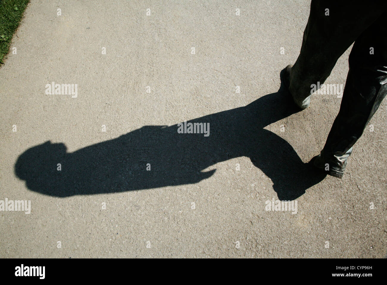 shadow of a man walking statue Stock Photo - Alamy