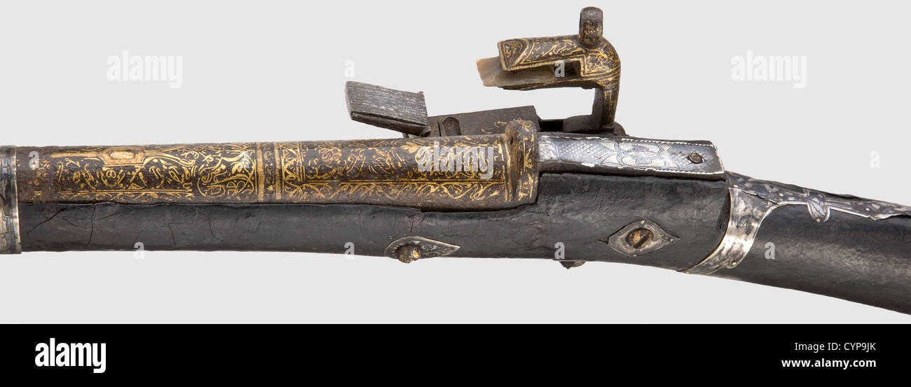 A Caucasian gold-inlaid miquelet-lock rifle,dated 1848.Round barrel ...