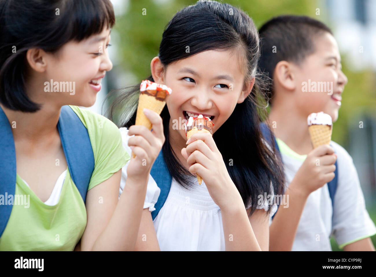 Happy schoolchildren eating ice cream hi-res stock photography and ...
