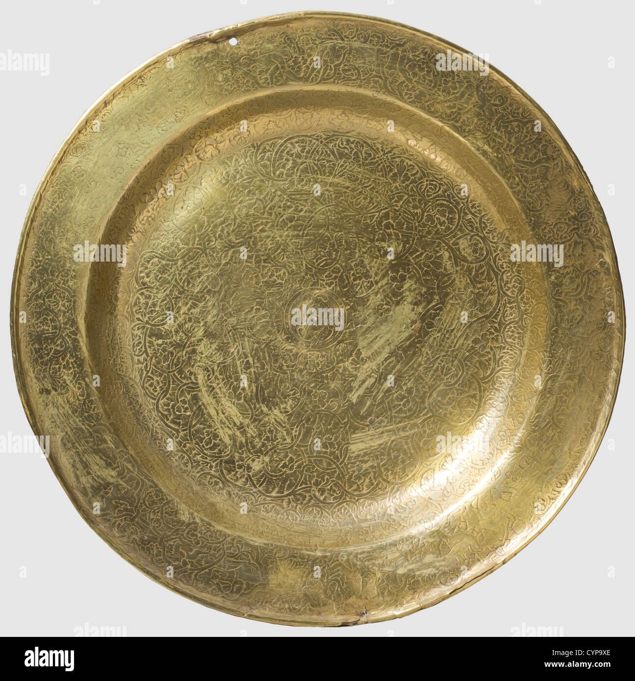 A Venetian engraved brass dish, ca. 1600. Shallow brass basin, the ...