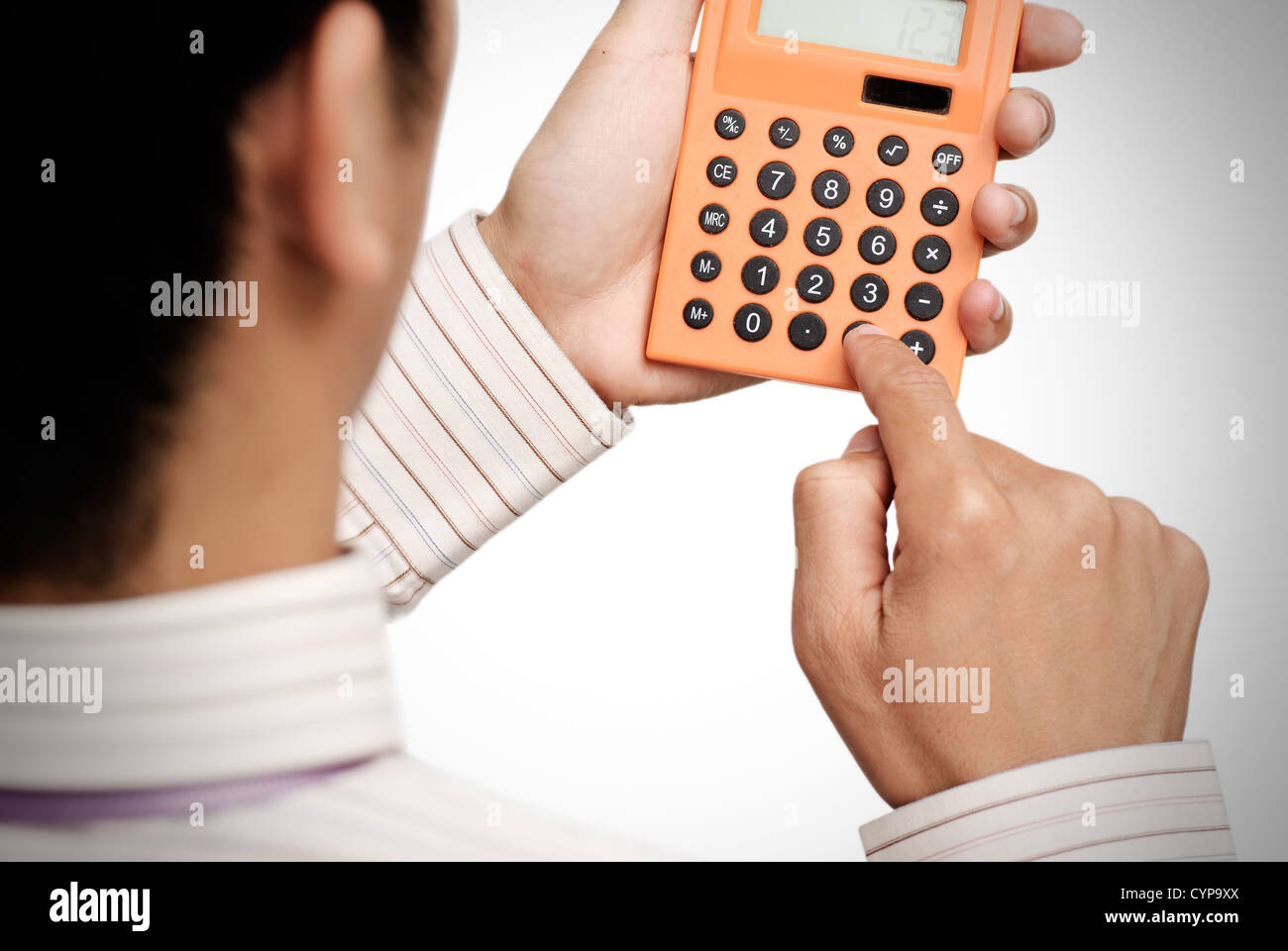 Business man use calculating machine on white background Stock Photo ...