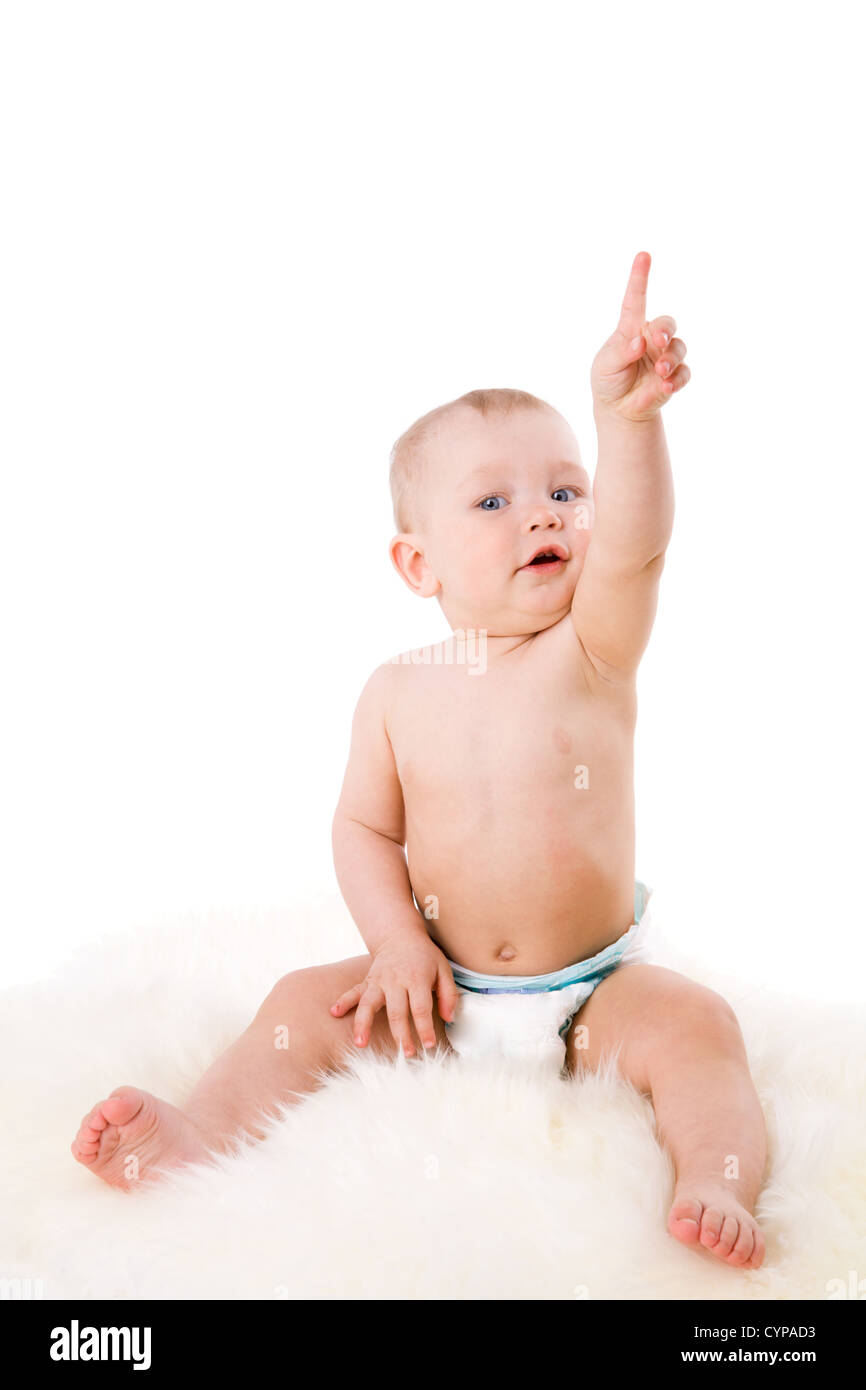 Baby pointing up sitting on fur isolated on white Stock Photo - Alamy