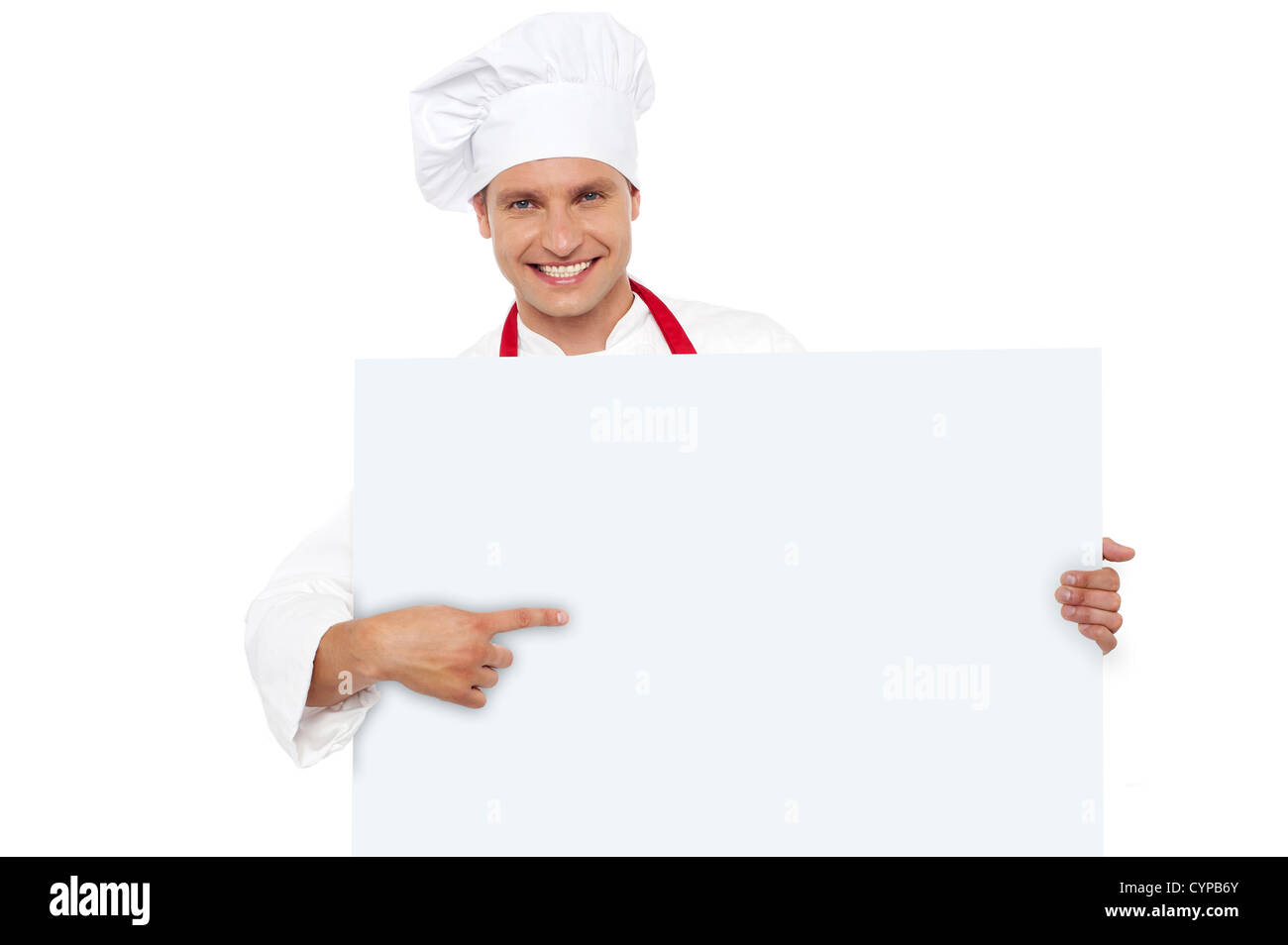 Chef pointing at the blank white billboard and smiling at camera Stock ...
