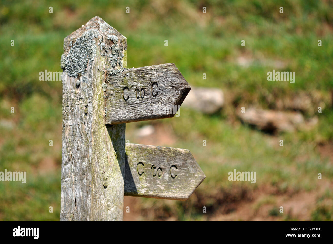 Signpost on the coast to coast path in Cumbria Stock Photo - Alamy