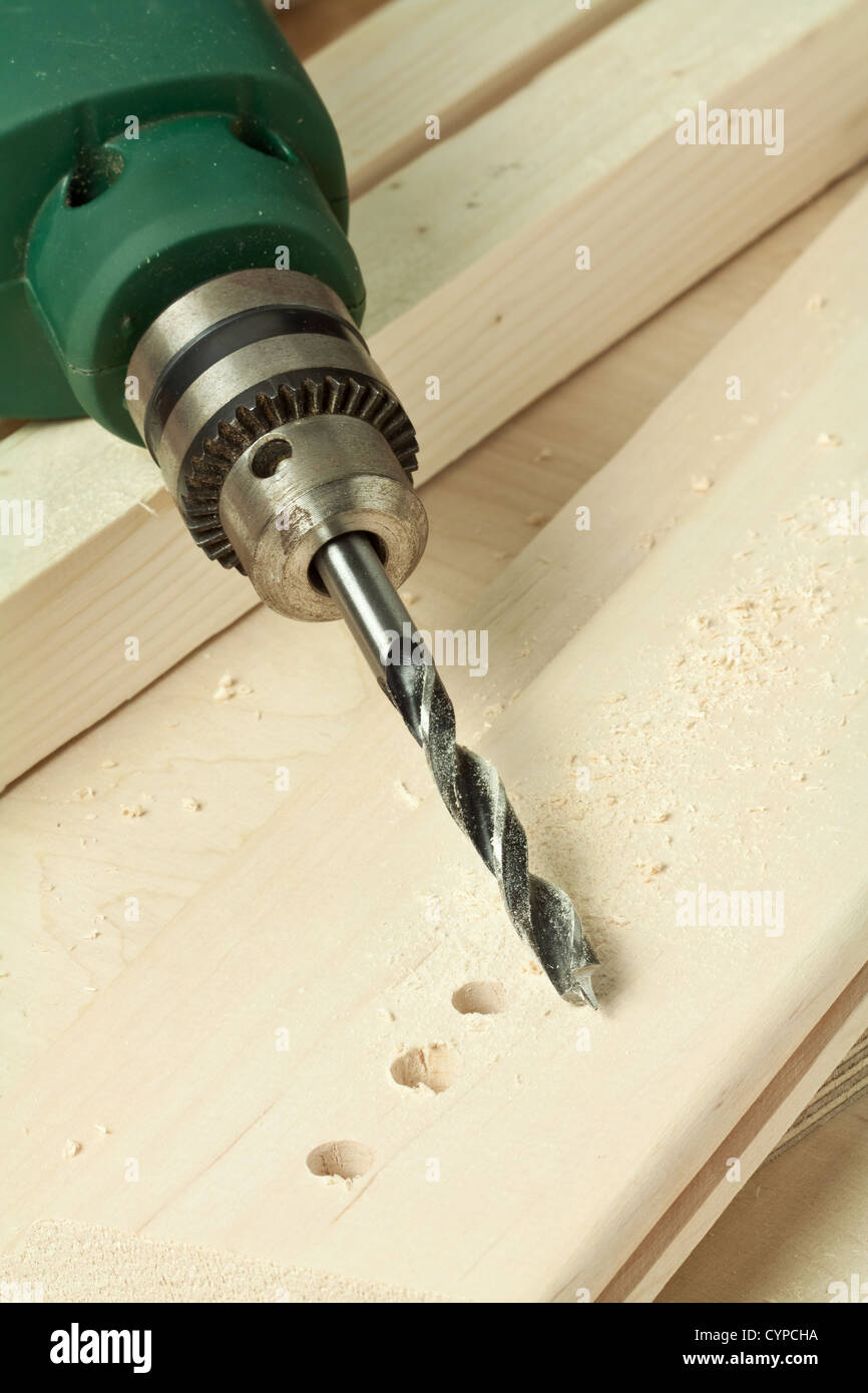 Drilling hole in a wooden plank Stock Photo - Alamy