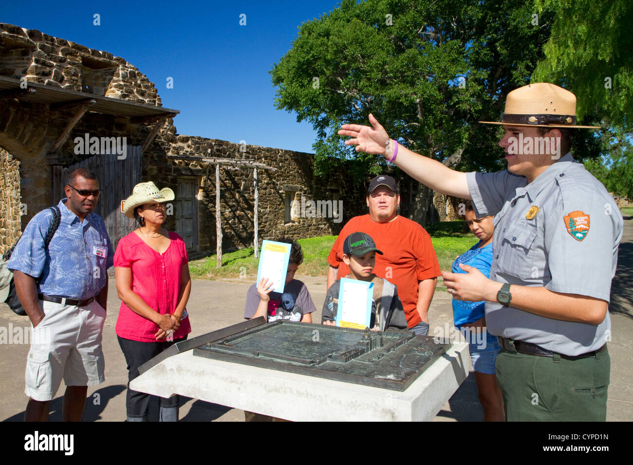 Park ranger informing tourists at the San Antonio Missions National ...