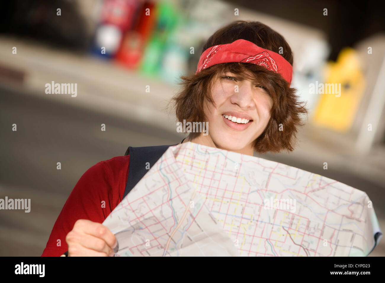 Lost Young Man on the Sidewalk with Map Stock Photo - Alamy