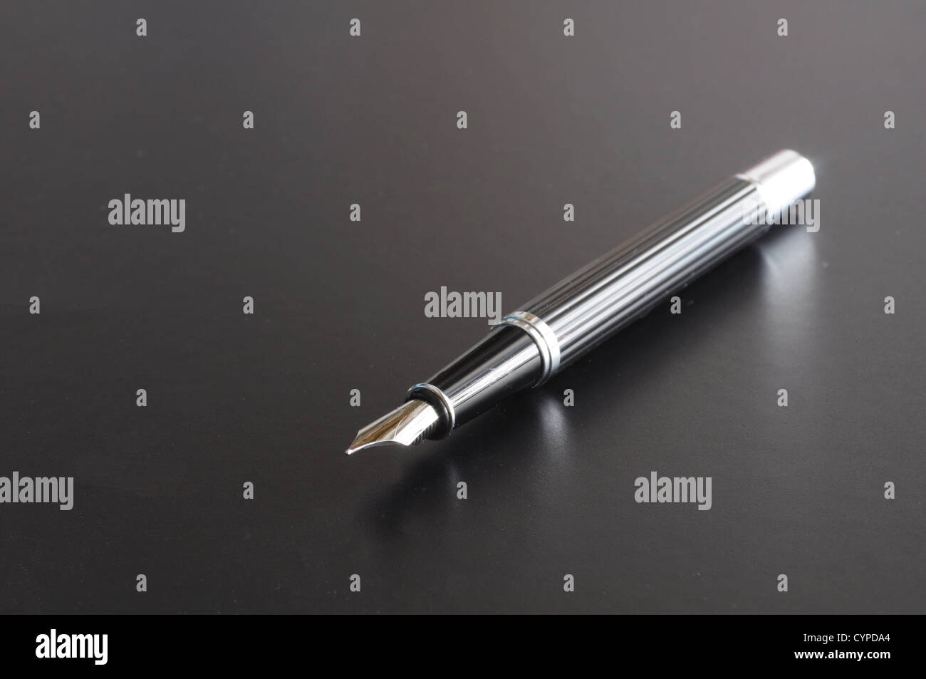 pen showing communication contact us or mail concept on black ...