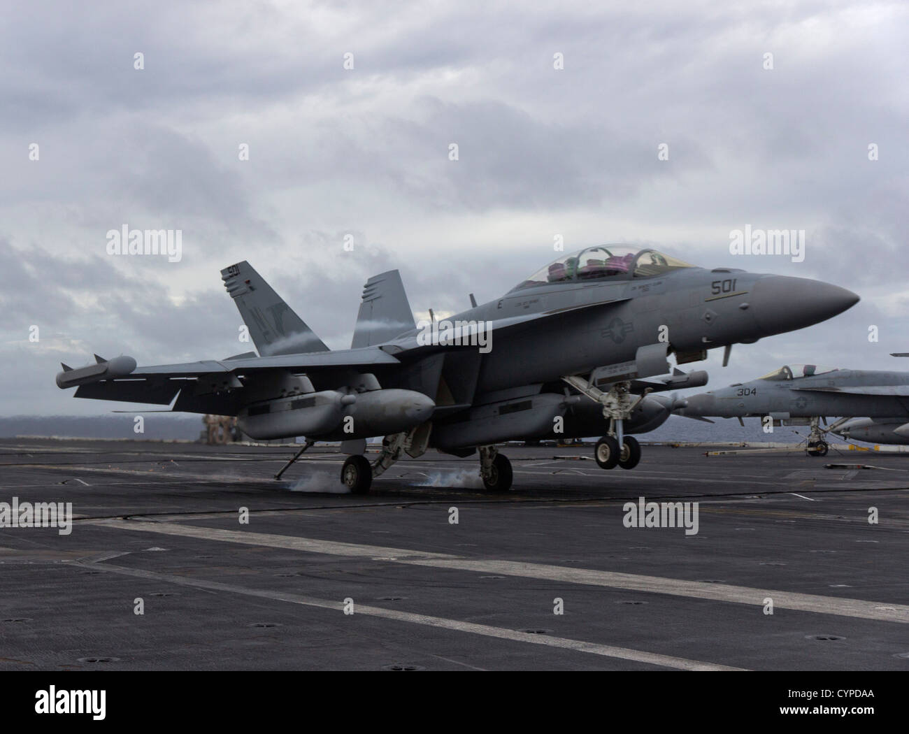 An EA-18G Growler from VAQ-141, Shadowhawks, lands aboard the USS George Washington (CVN 73) as ...
