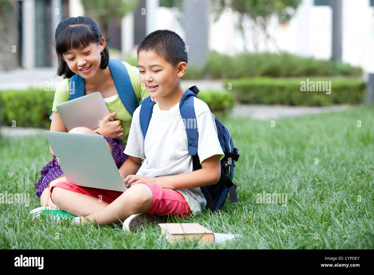 Elementary students using high-tech digital products Stock Photo - Alamy
