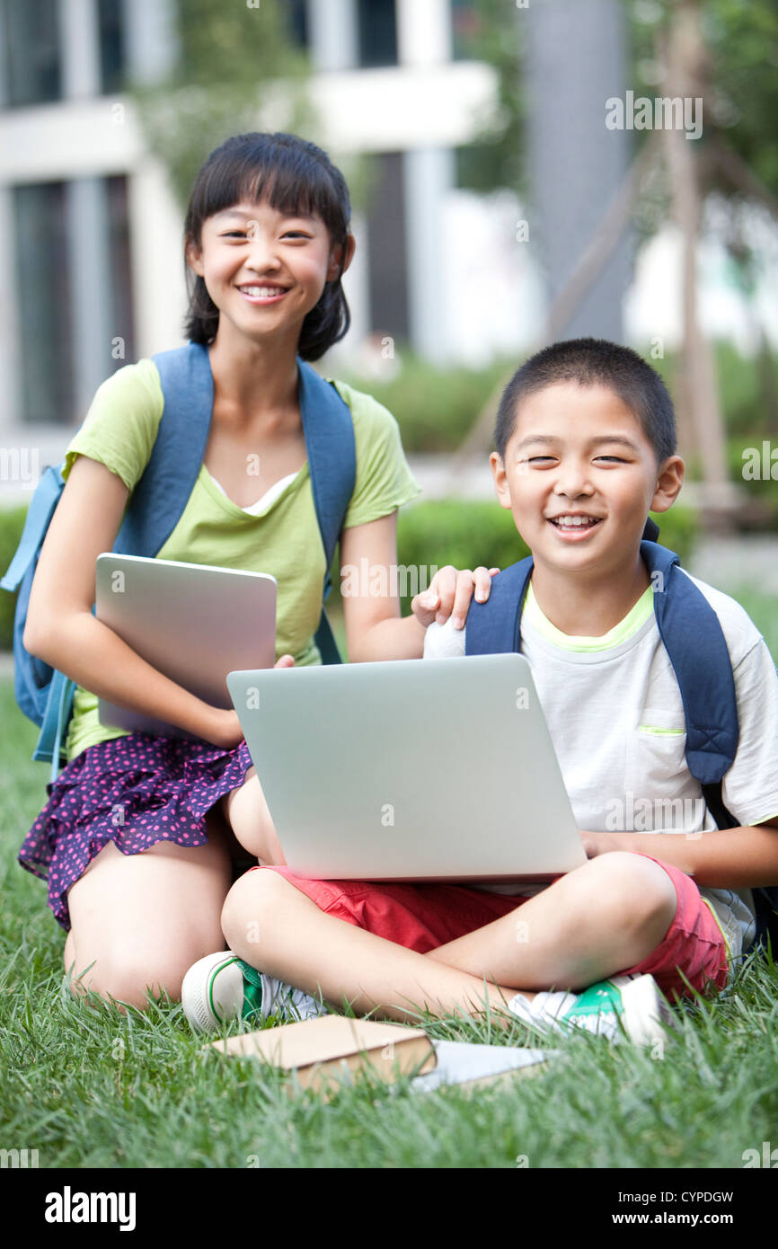 Elementary students with high-tech digital products Stock Photo - Alamy