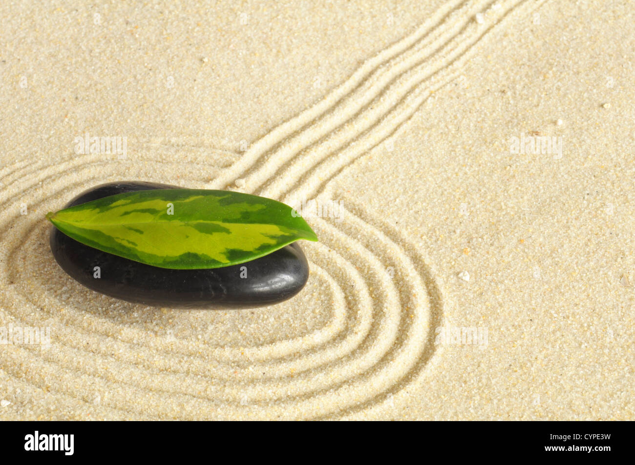 zen stone spa or wellness concept with sand Stock Photo - Alamy
