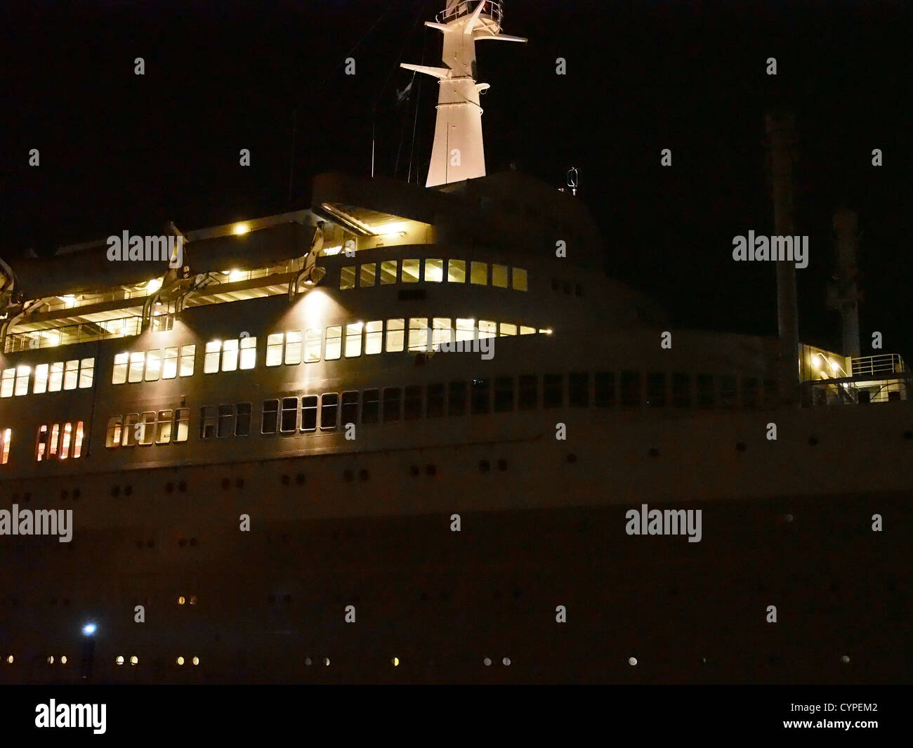 The SS Rotterdam, a Dutch ocean liner, is illuminated at night in this ...