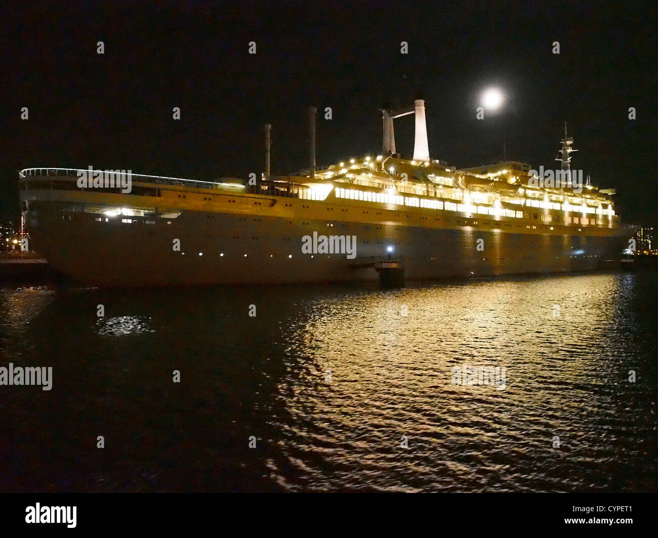 The SS Rotterdam, a former Dutch ocean liner, is illuminated at night ...