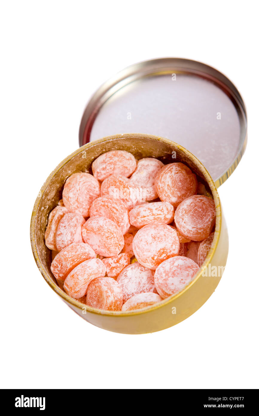 Orange candies inside tin jar Stock Photo - Alamy