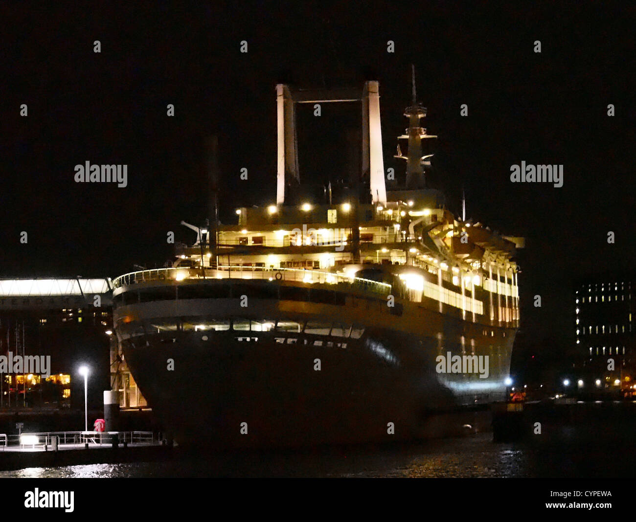 The SS Rotterdam, a retired ocean liner, is illuminated at night. This ...