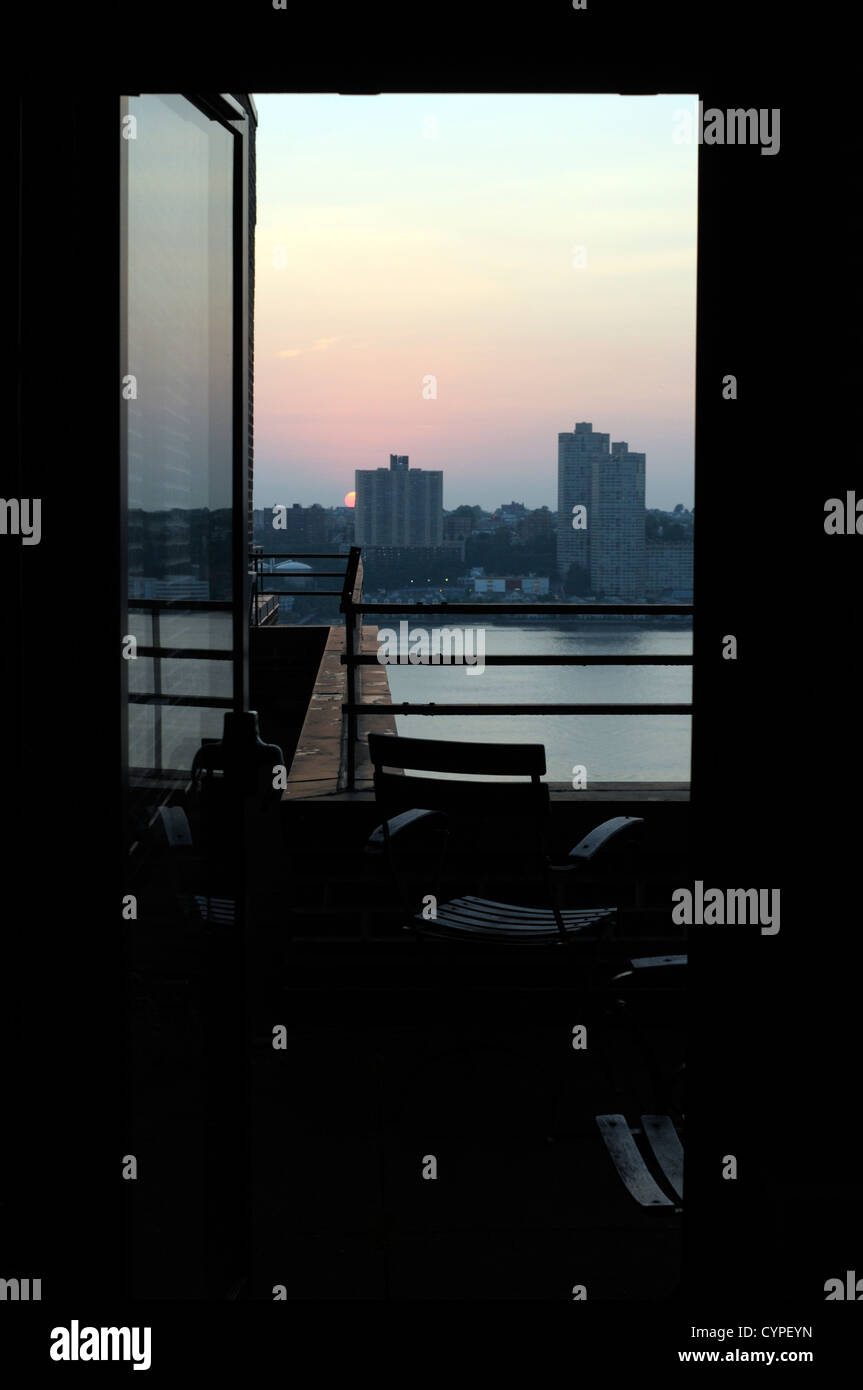 Sunset looking over the Hudson River out of a penthouse window. New ...