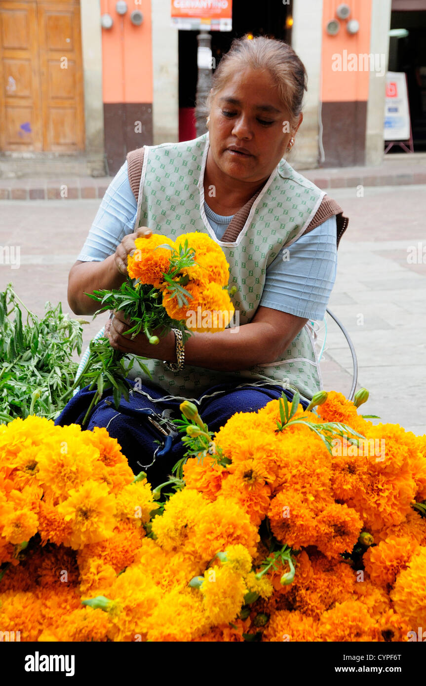 Plaza del baratillo woman preparing marigolds on street stall hi-res ...