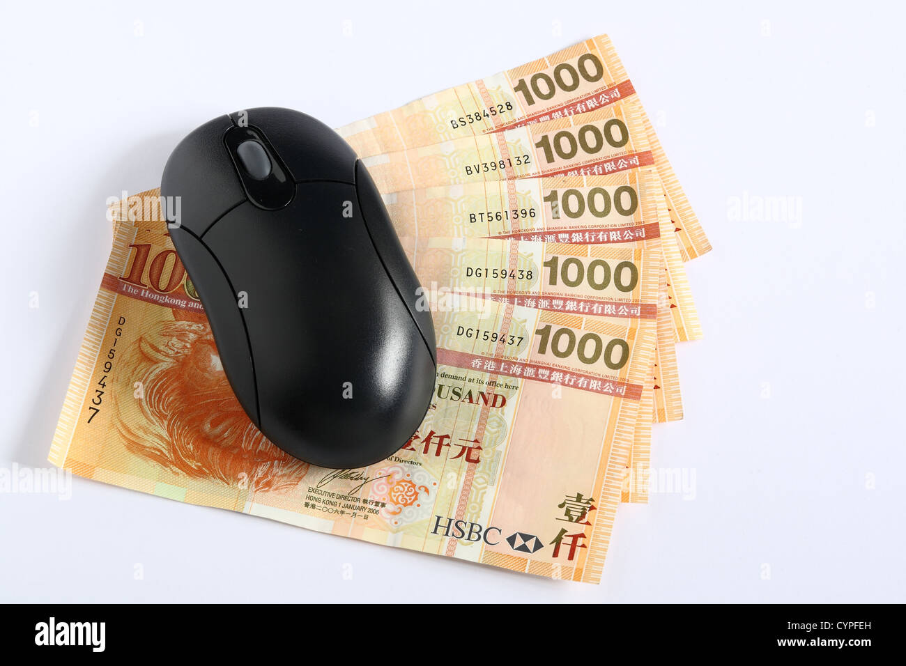 Using money online by a mouse Stock Photo - Alamy