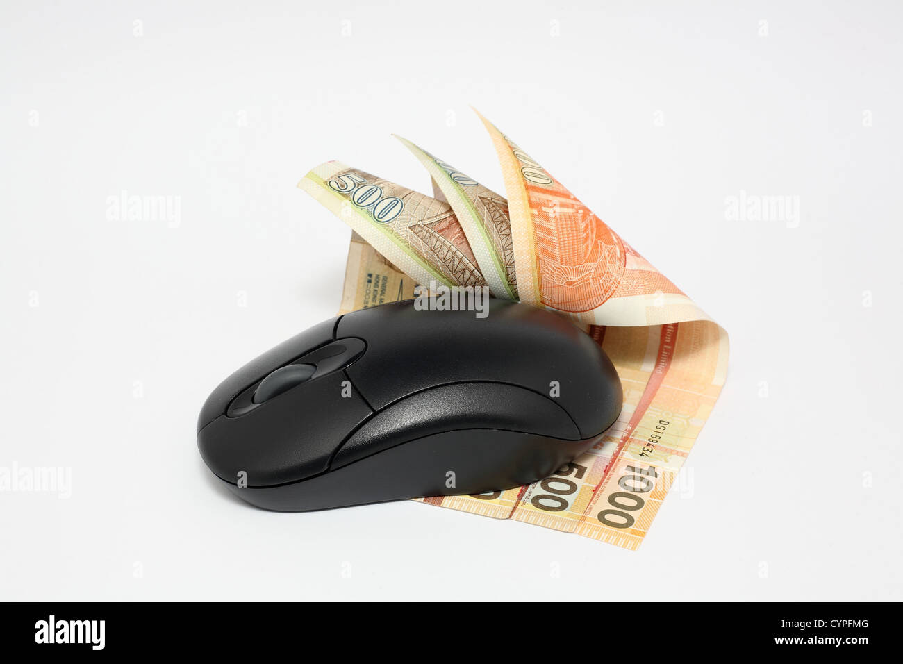 Using money online by mouse Stock Photo - Alamy