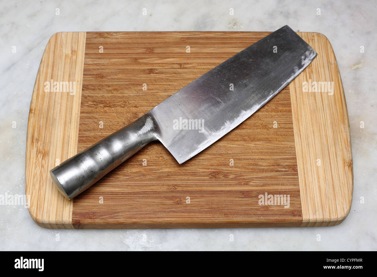 Closeup image of chinese kitchen knife on cutting board Stock Photo - Alamy