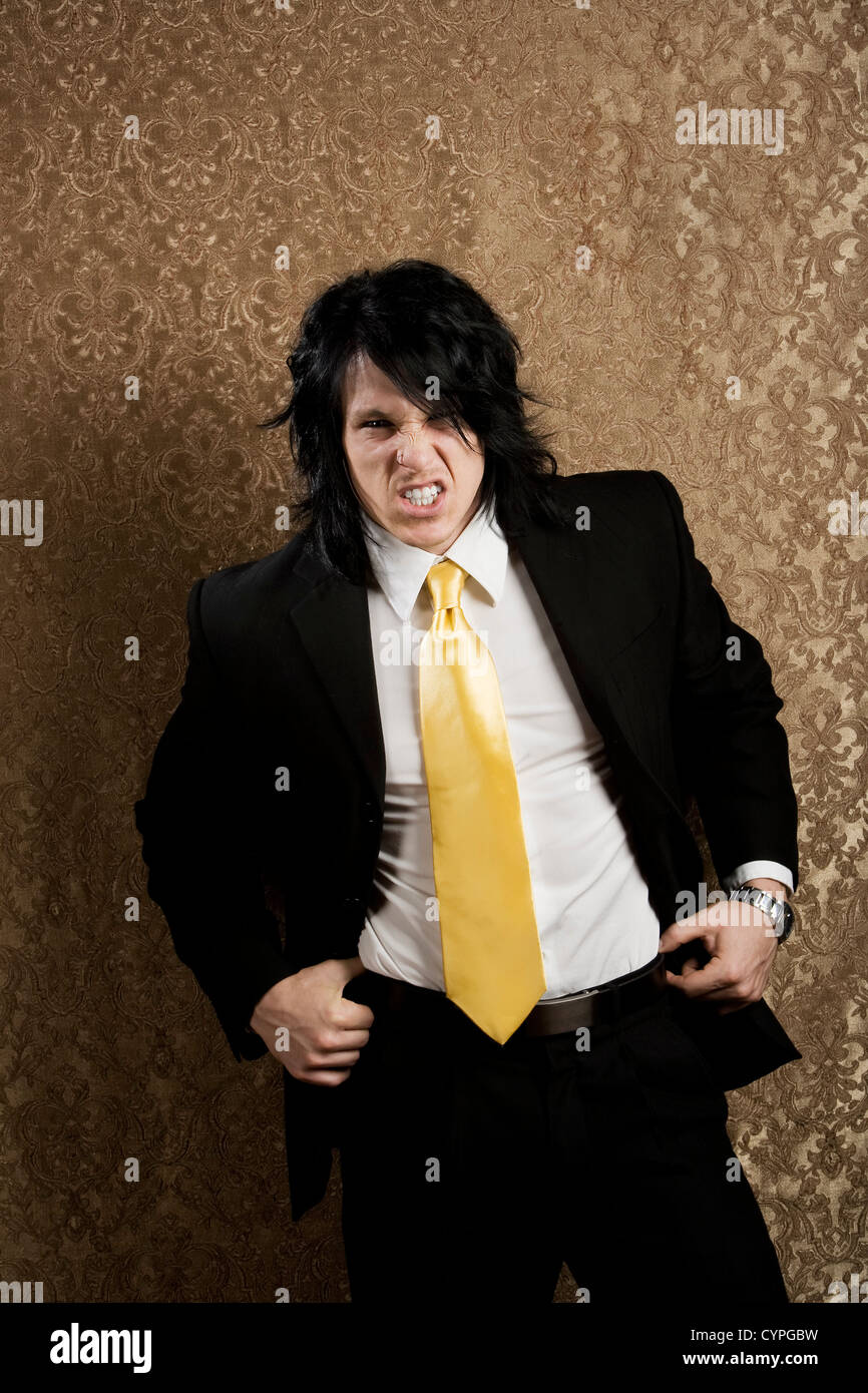 Handsome angry man in an aggressive stance Stock Photo - Alamy