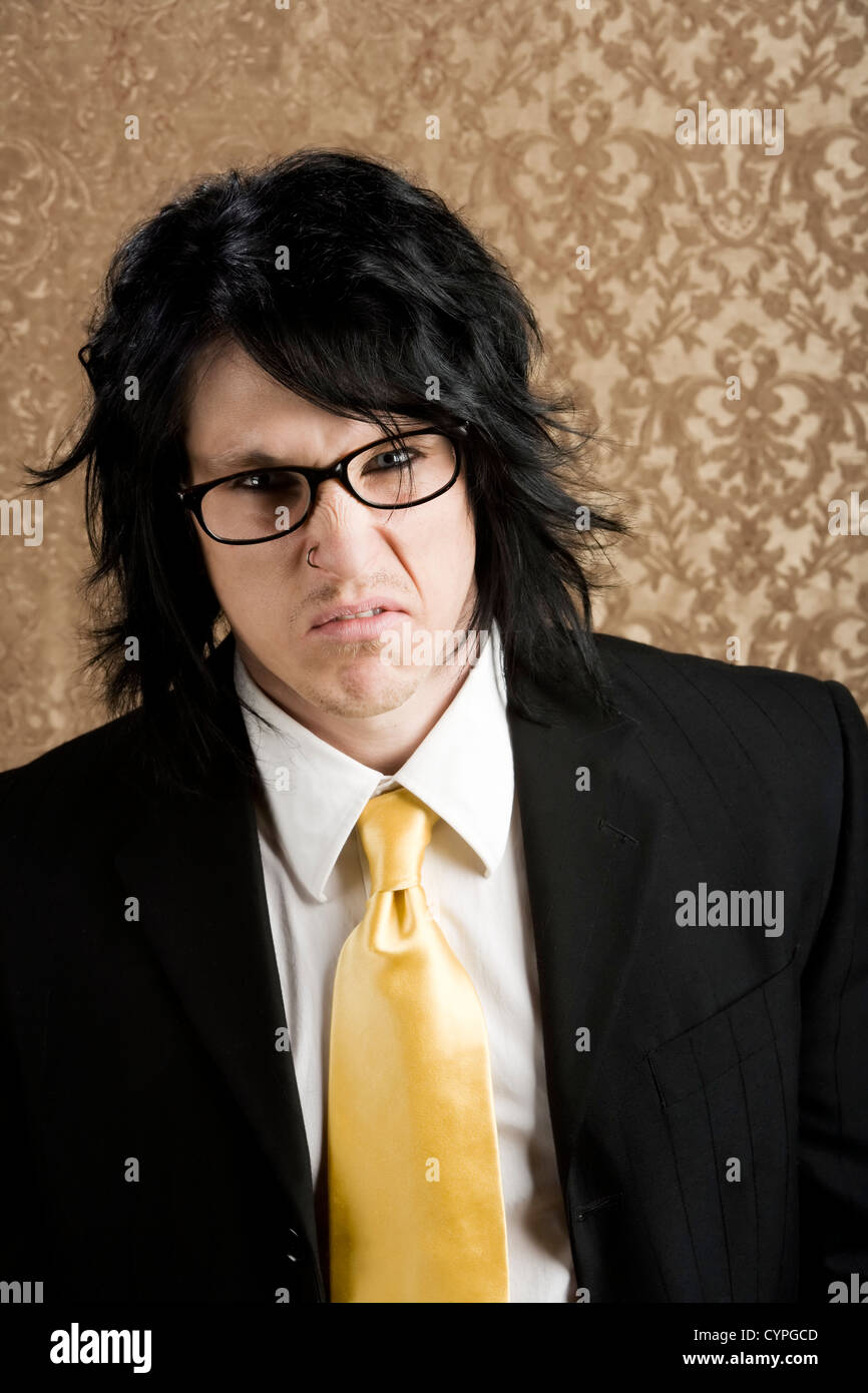 Young man with an unpleasant expression on his face Stock Photo - Alamy