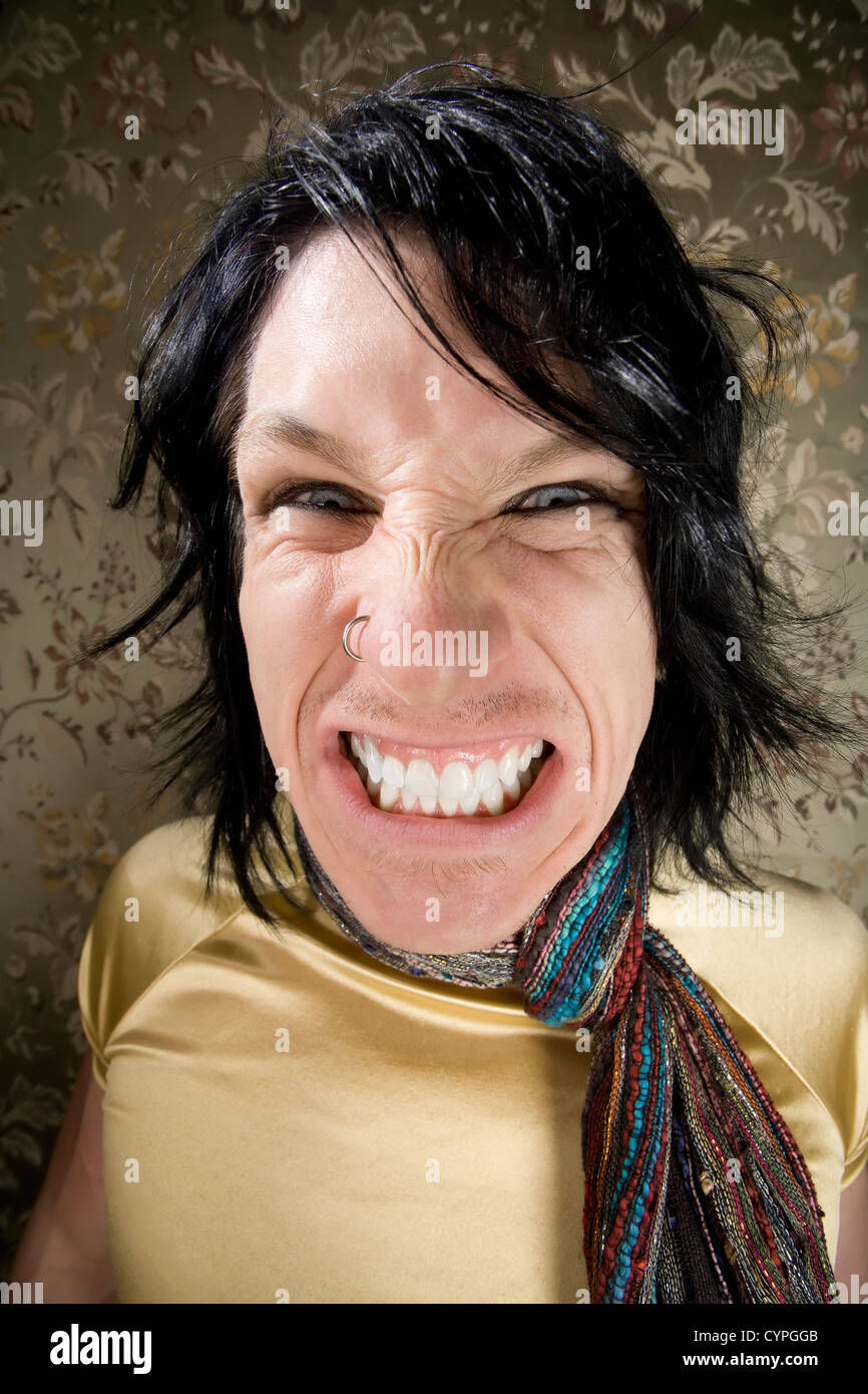 Young man making an aggressive mean face Stock Photo - Alamy