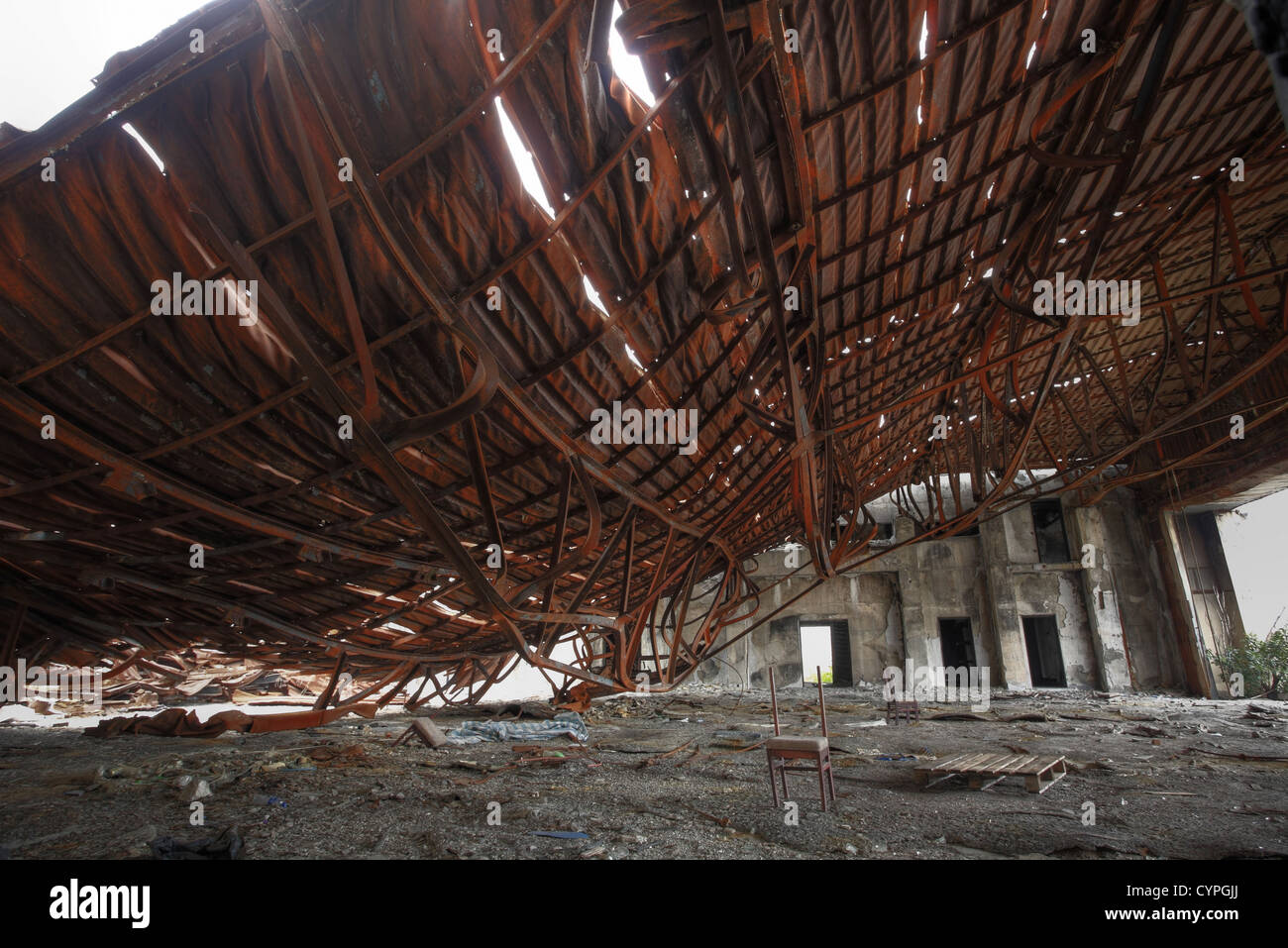 discarded building, metal roof fall down Stock Photo - Alamy