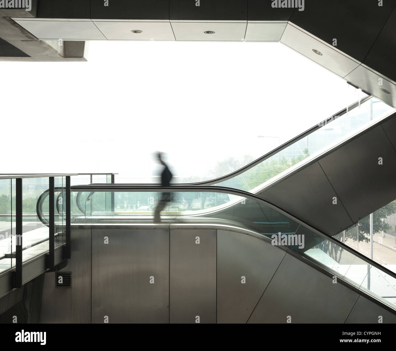 business man move on escalator Stock Photo - Alamy