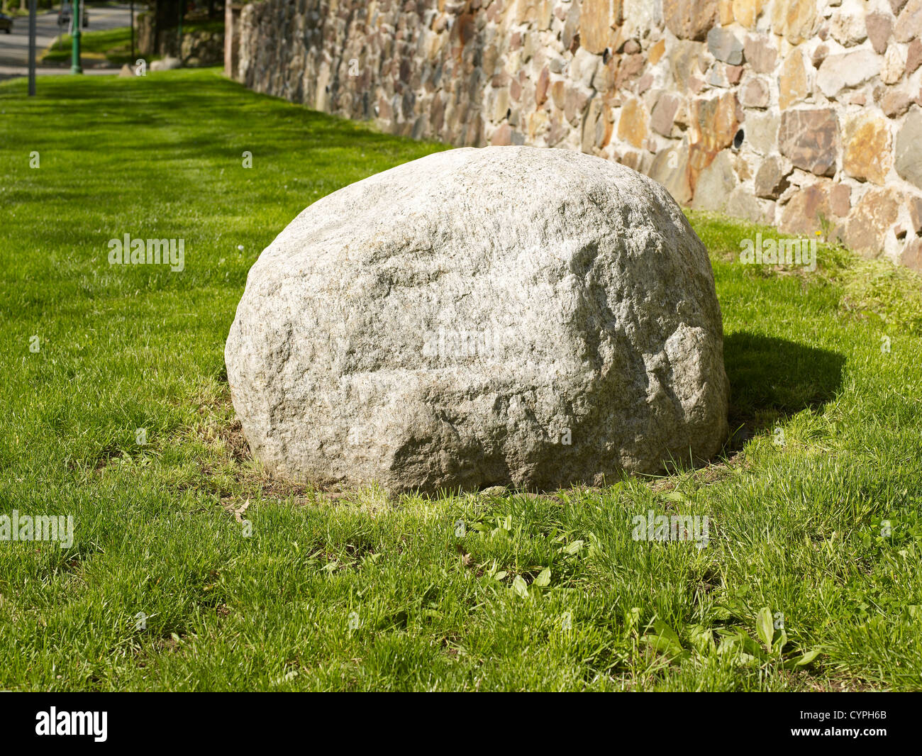 Big rock and grass Stock Photo - Alamy