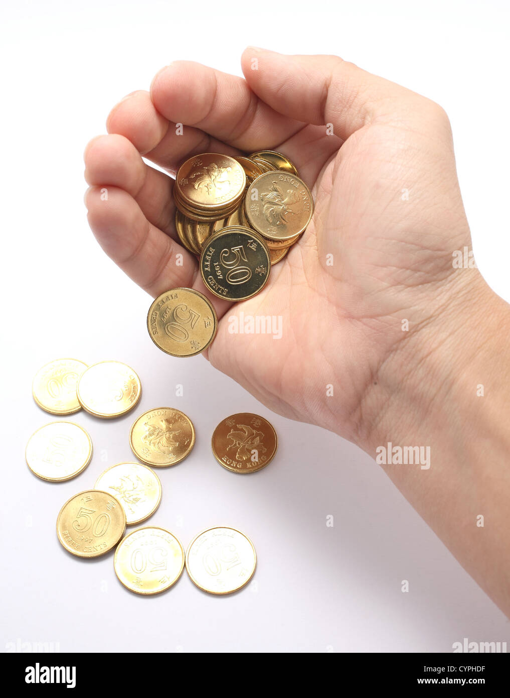 A hand dropping coins Stock Photo - Alamy