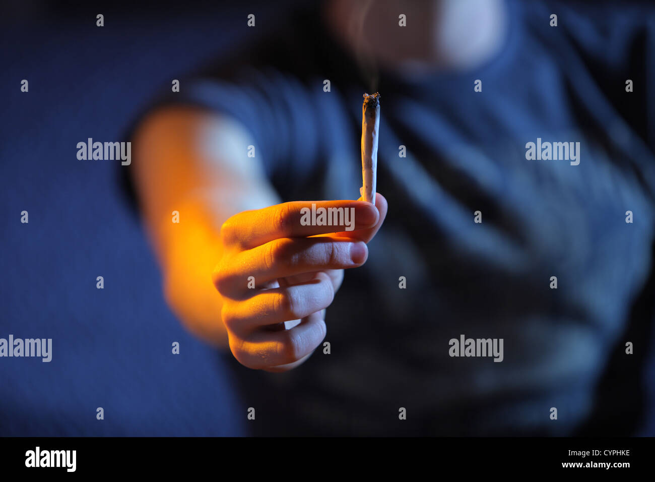 Smoking joint. Hand close up. Copy space Stock Photo - Alamy