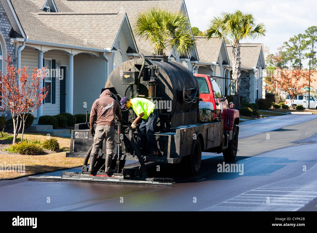 Workers performing road construction hi-res stock photography and ...