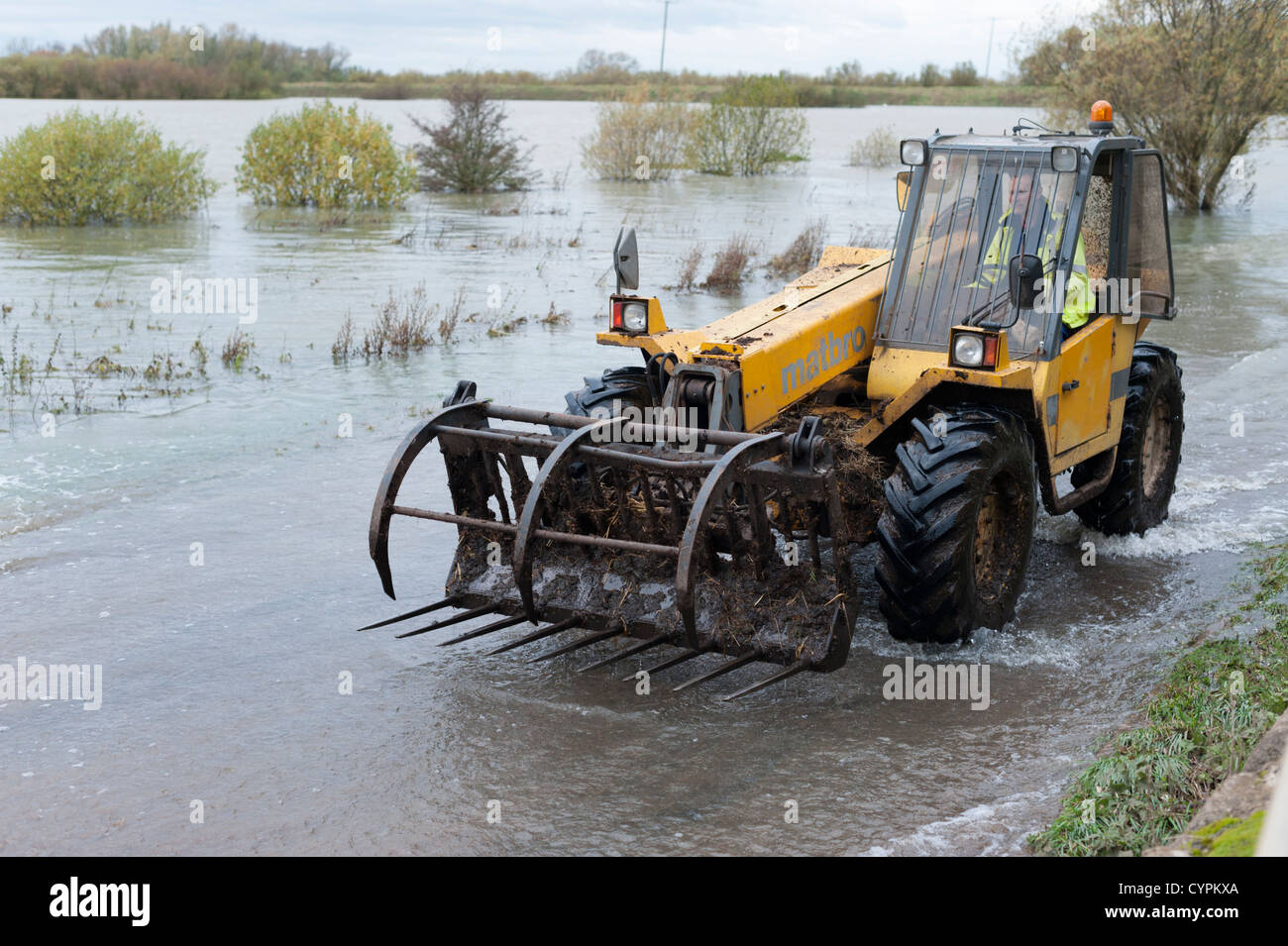 A Matbro tractor in flood water at Sutton Gault on the Ouse Washes ...