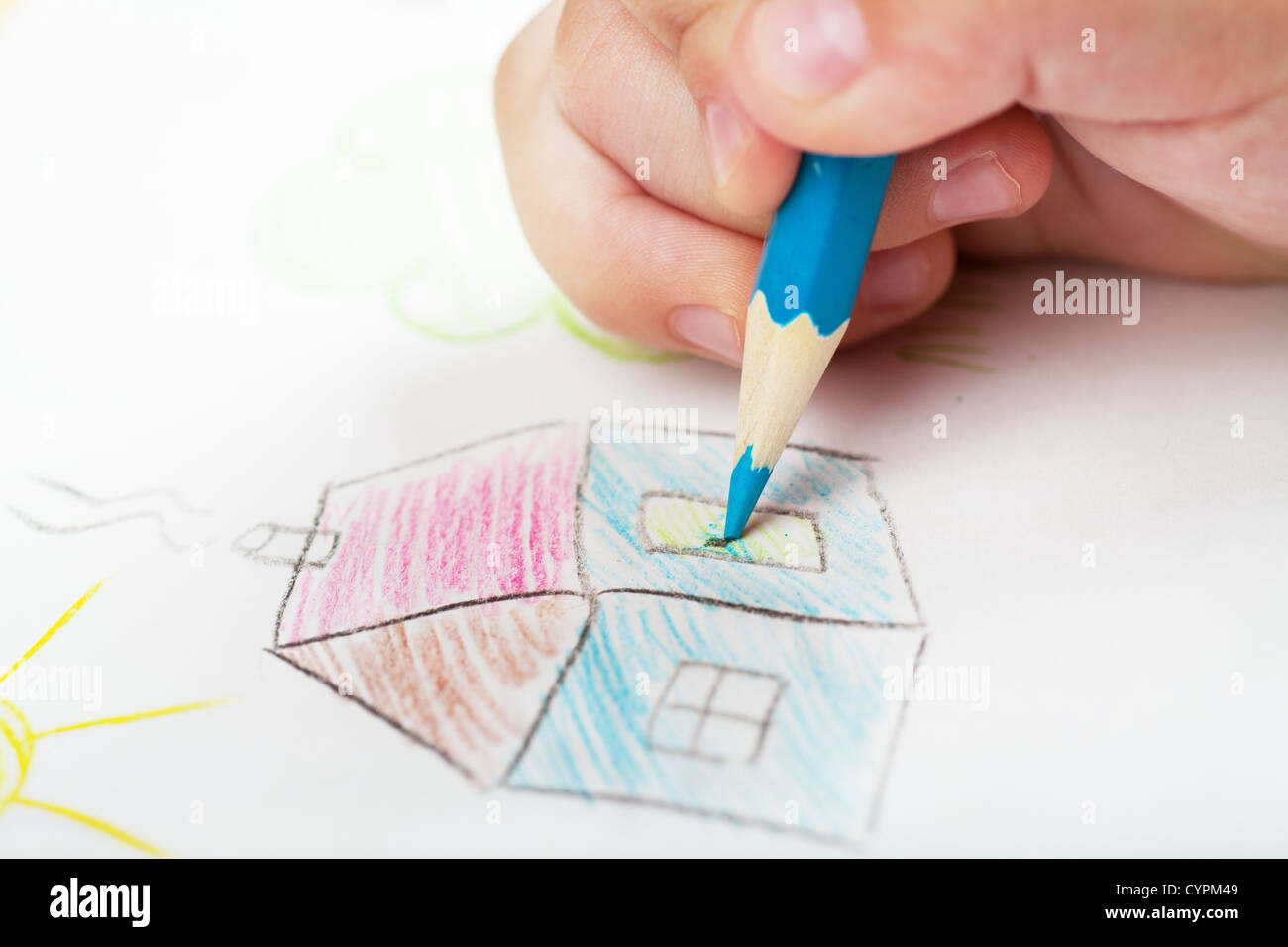 Child's hand drawing a house with blue pen Stock Photo - Alamy