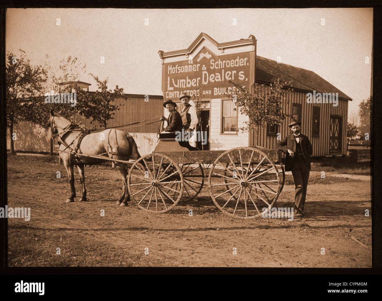 Horse and Buggy and Men in Front of a Lumber Store, 1900 Stock Photo ...