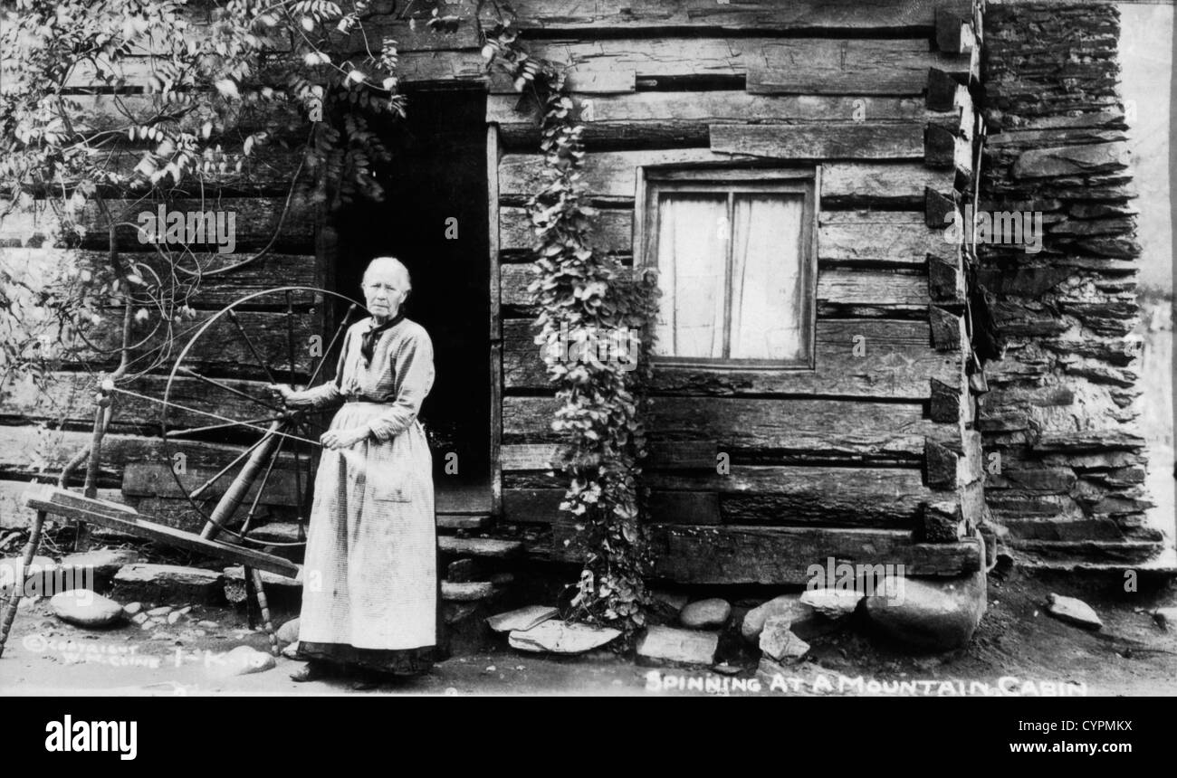 Woman with Spinning Wheel Beside Log Cabin, Circa 1910 Stock Photo - Alamy