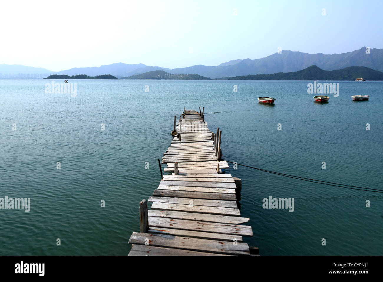 Looking over a pier and a boat Stock Photo - Alamy