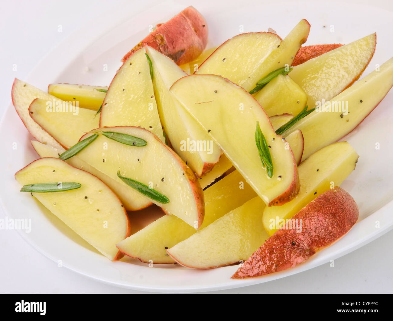 Herb marinated potatoes Stock Photo - Alamy