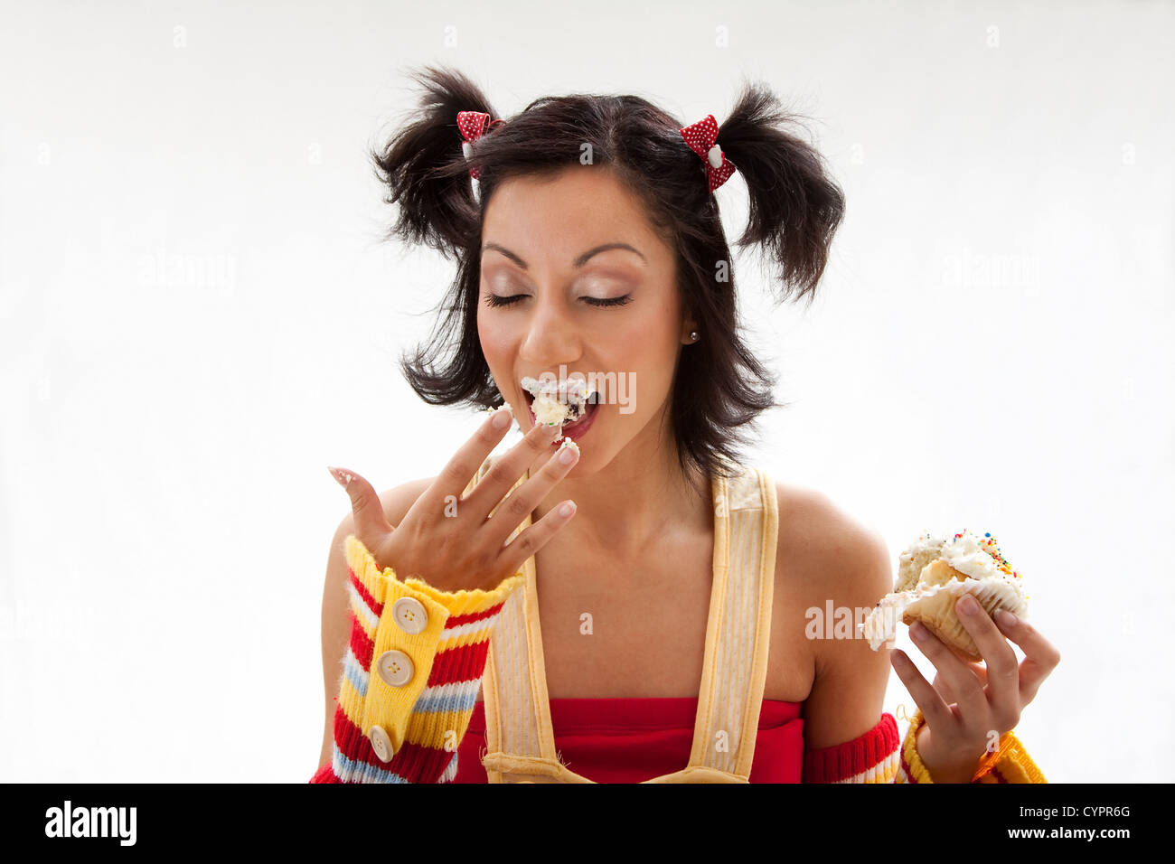 Girl licking cake icing hi-res stock photography and images - Alamy