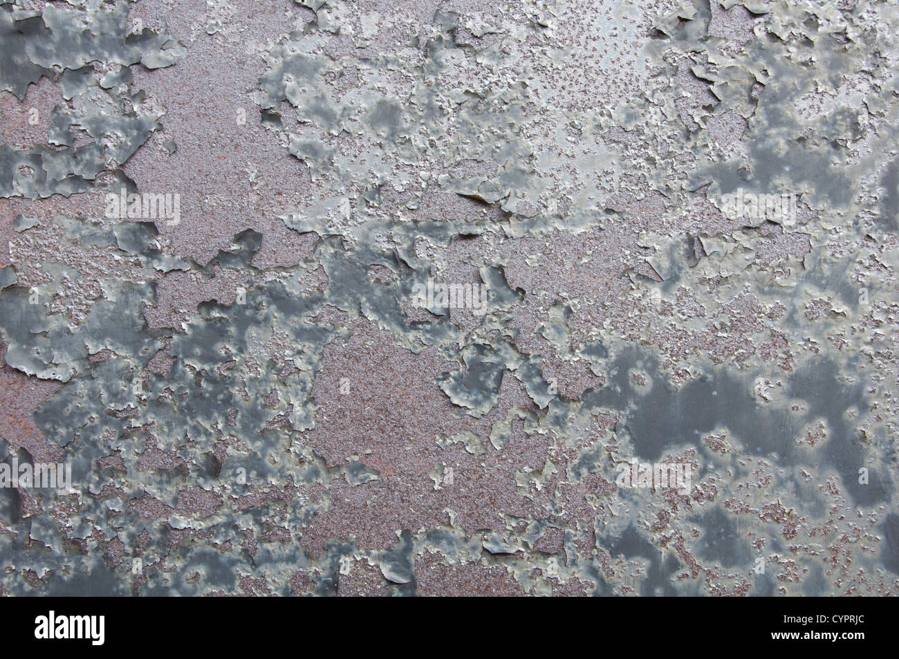 Abstract textures. A rusty metal surface roughly textured with flaking ...