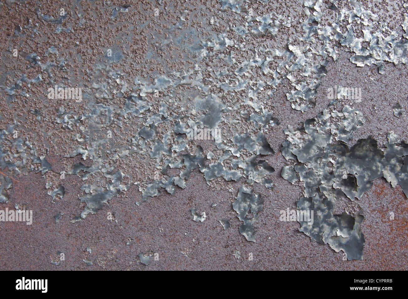 Abstract textures. A rusty metal surface roughly textured with flaking ...