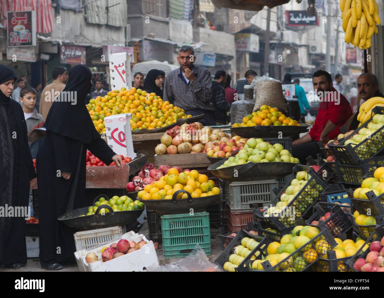 Women shop at a fruit shop in fardos hi-res stock photography and ...