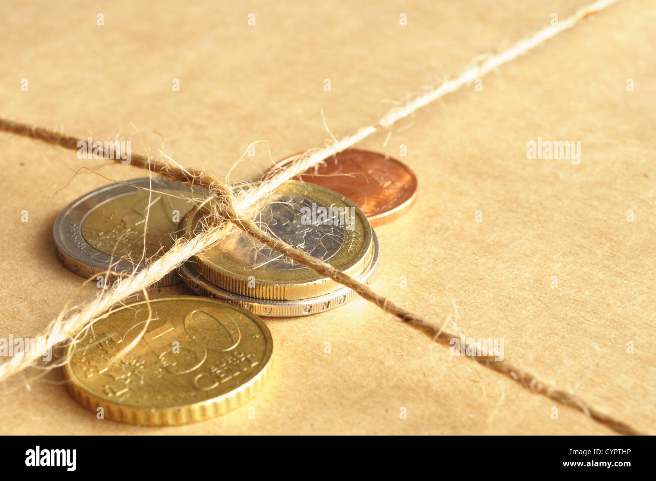 forwarding charges or shipping money concept with coins and parcel ...