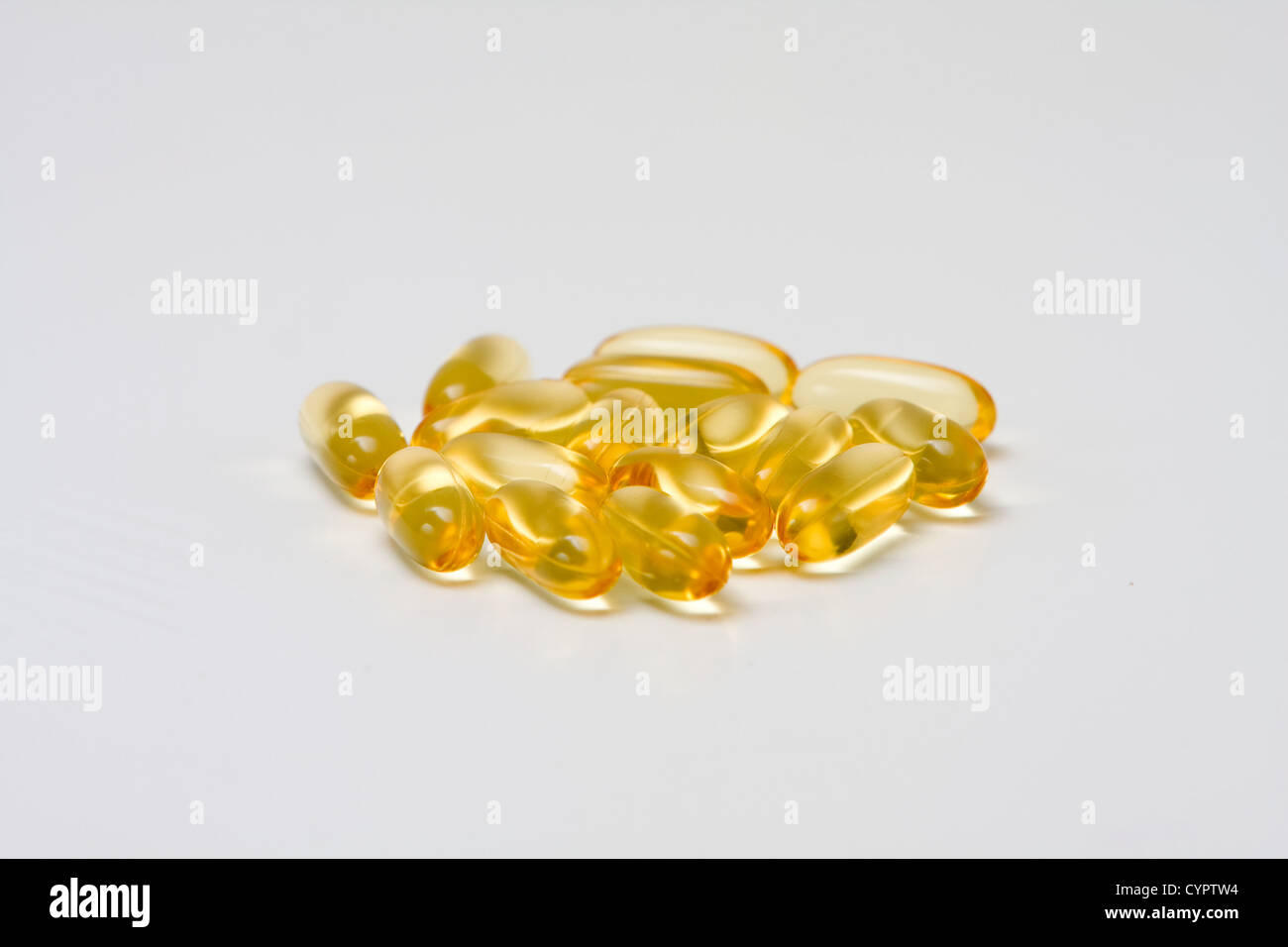 Yellow vitamin capsules with Omega 3 oil, isolated Stock Photo - Alamy