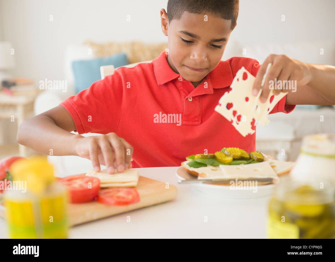 Hispanic boy making sandwich Stock Photo - Alamy