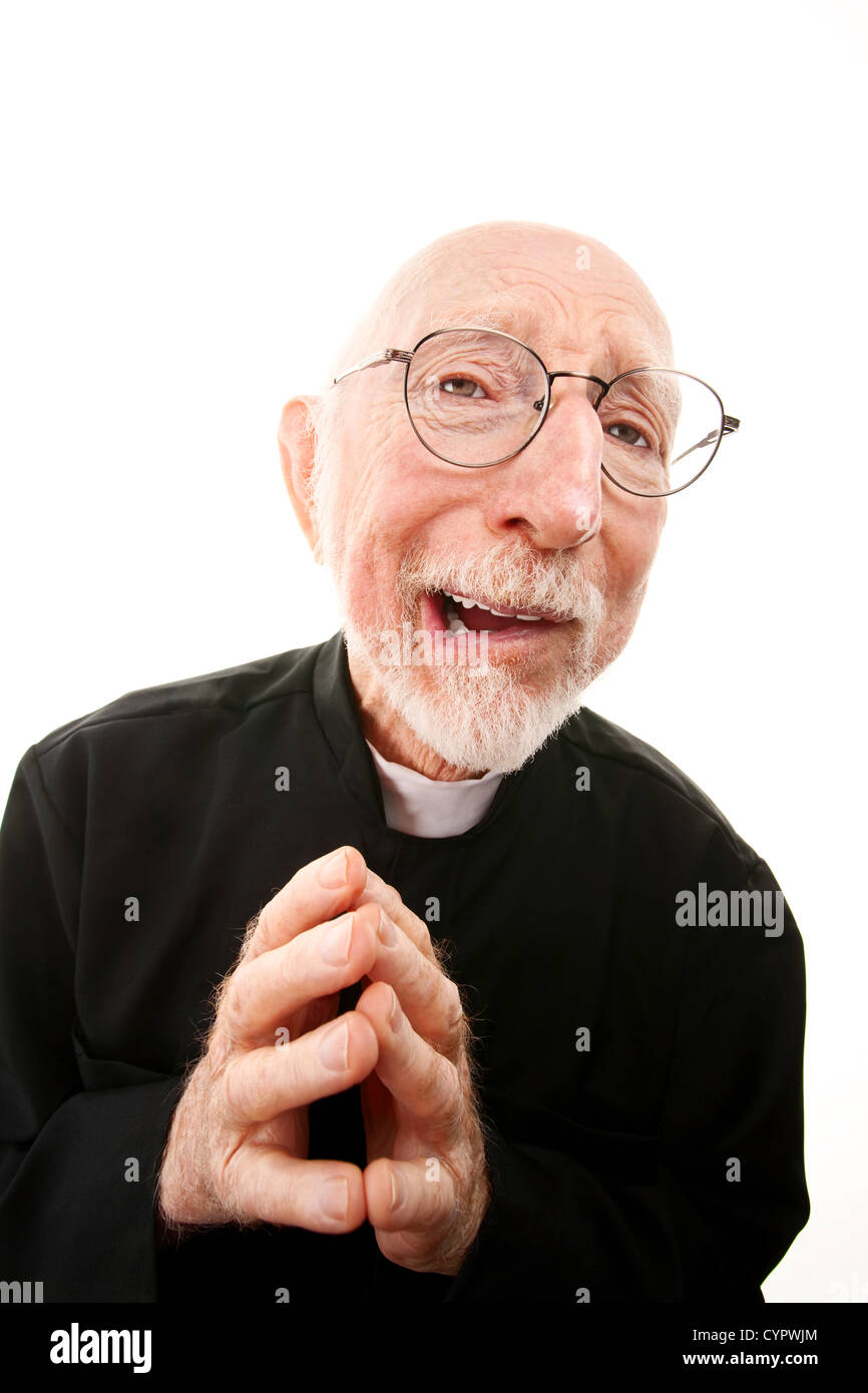 Funny priest with folded hands and glasses Stock Photo - Alamy