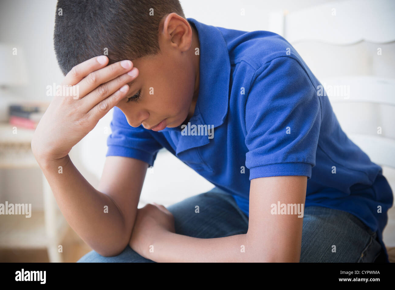 Unhappy Hispanic boy Stock Photo - Alamy