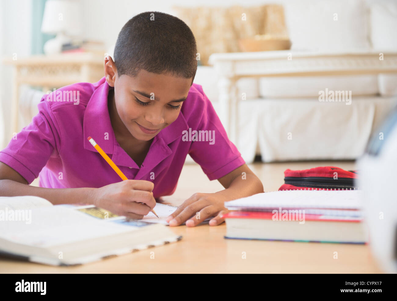 Hispanic boy doing homework Stock Photo - Alamy